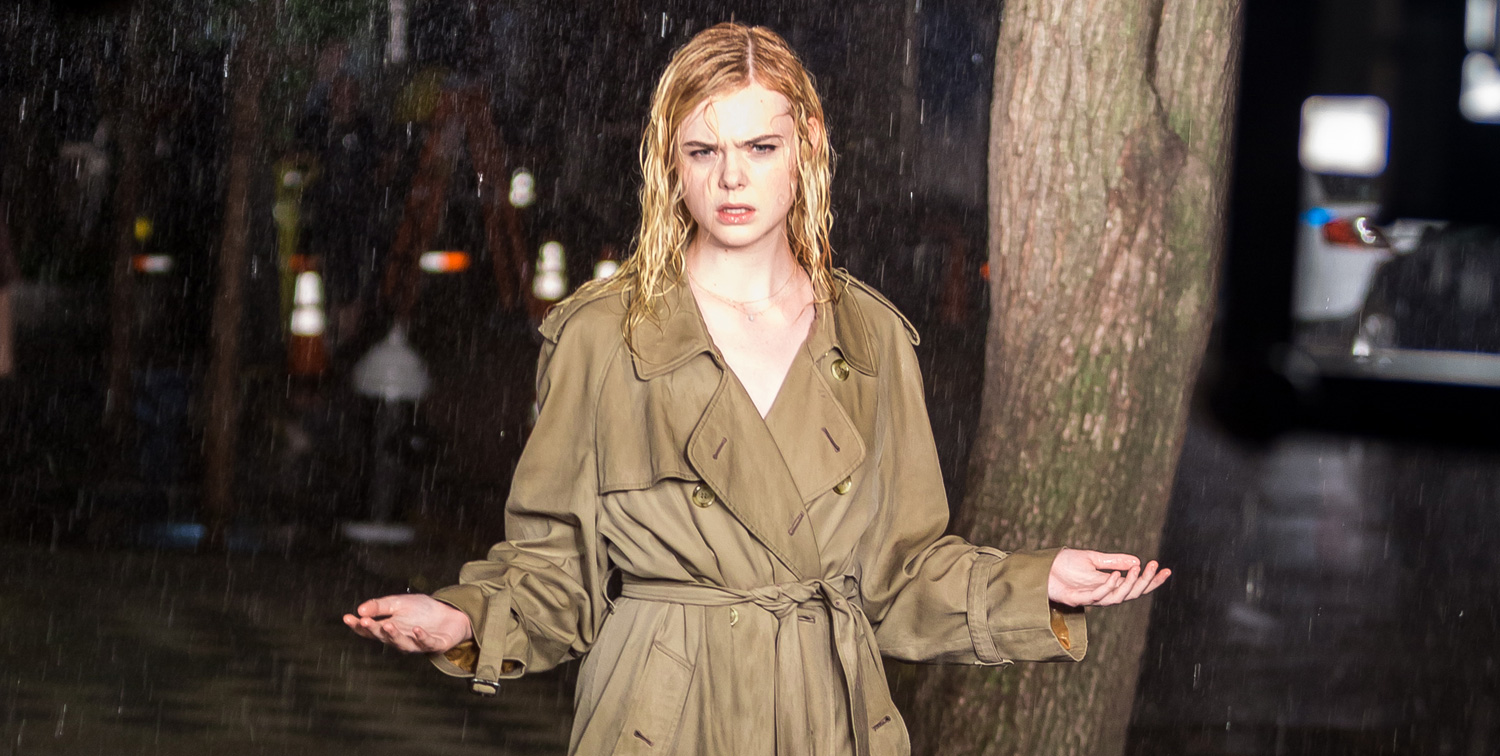 Elle Fanning Sports a Trench Coat in the Rain on Woody Allen Film Set ...